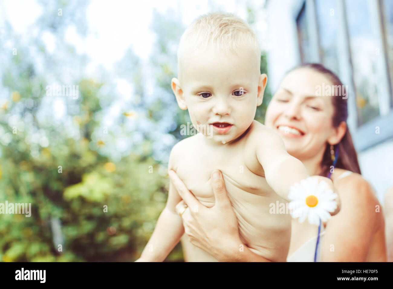 child focus parents on the background Stock Photo - Alamy