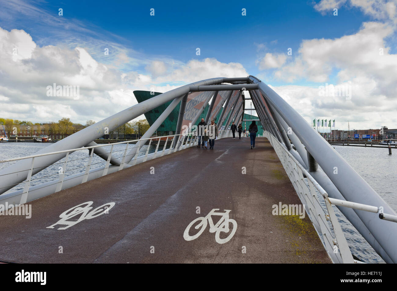 A modern bridge leading to the Nemo (Science) Museum, designed in the ...