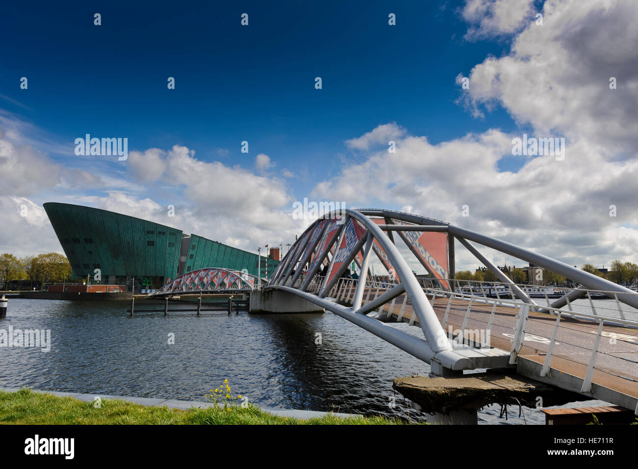 A modern bridge leading to the Nemo (Science) Museum, designed in the ...