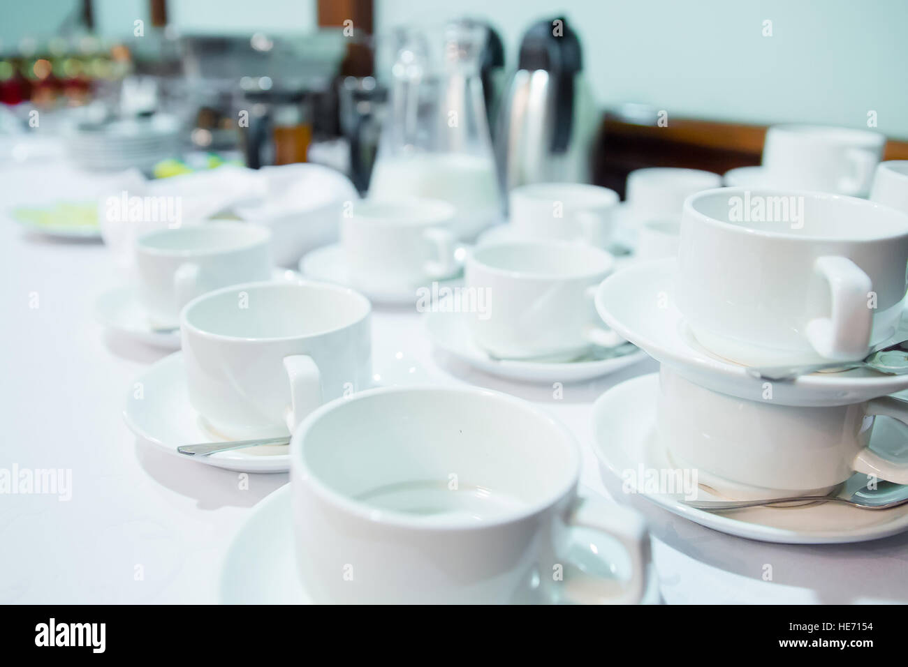 white cup for a banquet put on each other on a white table Stock Photo ...
