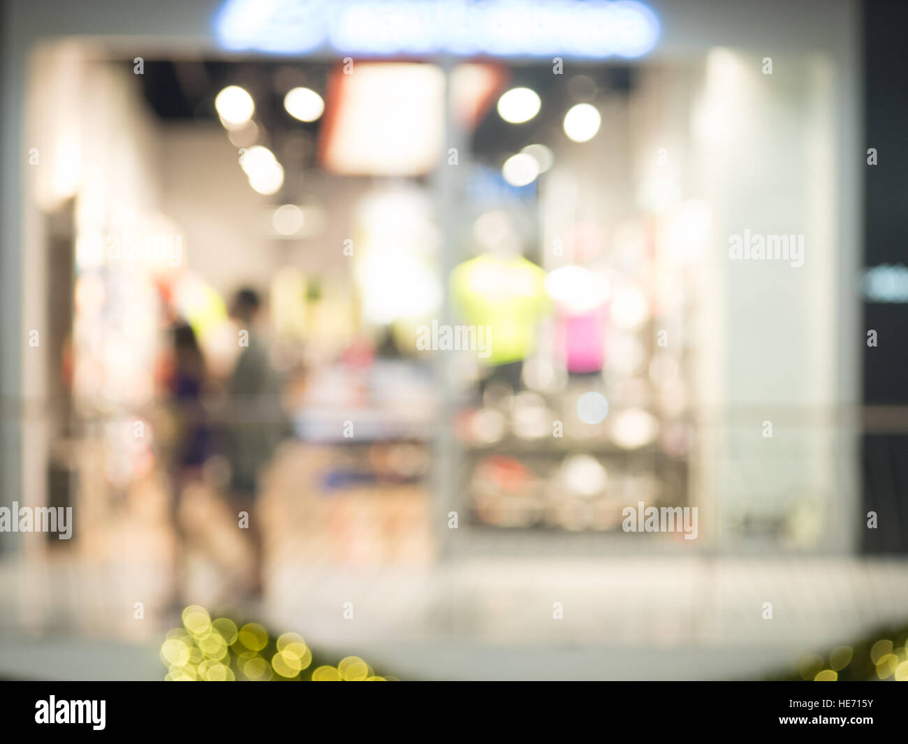 two people walking pass store blur background with bokeh Stock Photo ...