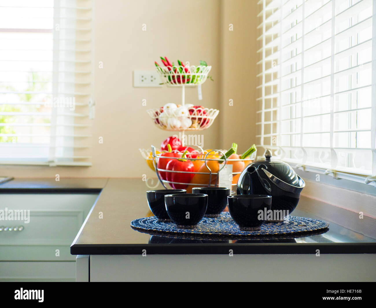 tea set and vegetables in kitchen concept fo health and interior design ...