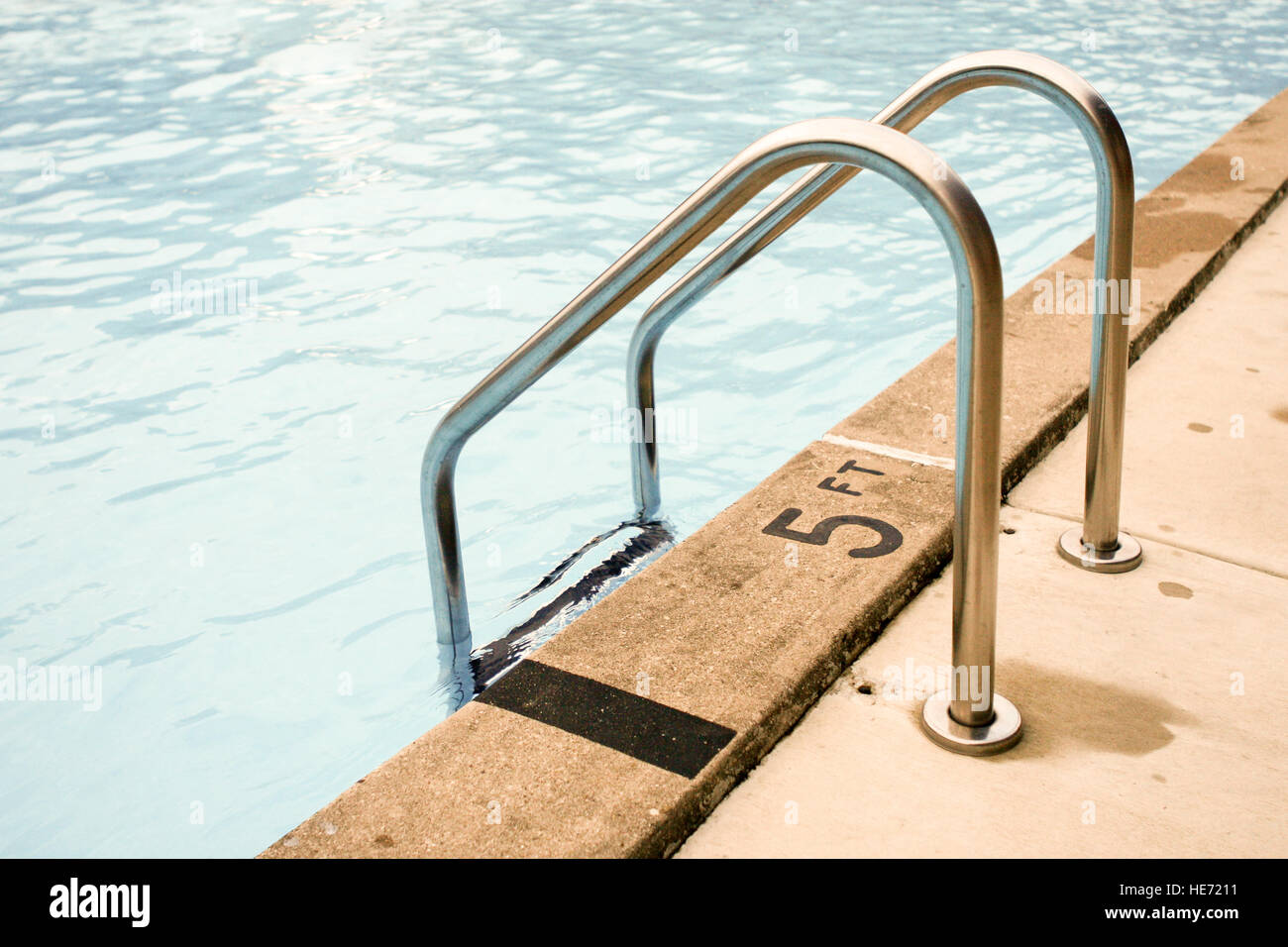 Swimming pool ladder Stock Photo - Alamy