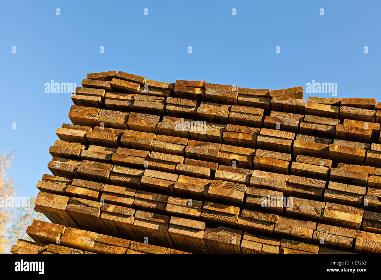 Stack of wooden boards in sawmill Stock Photo - Alamy