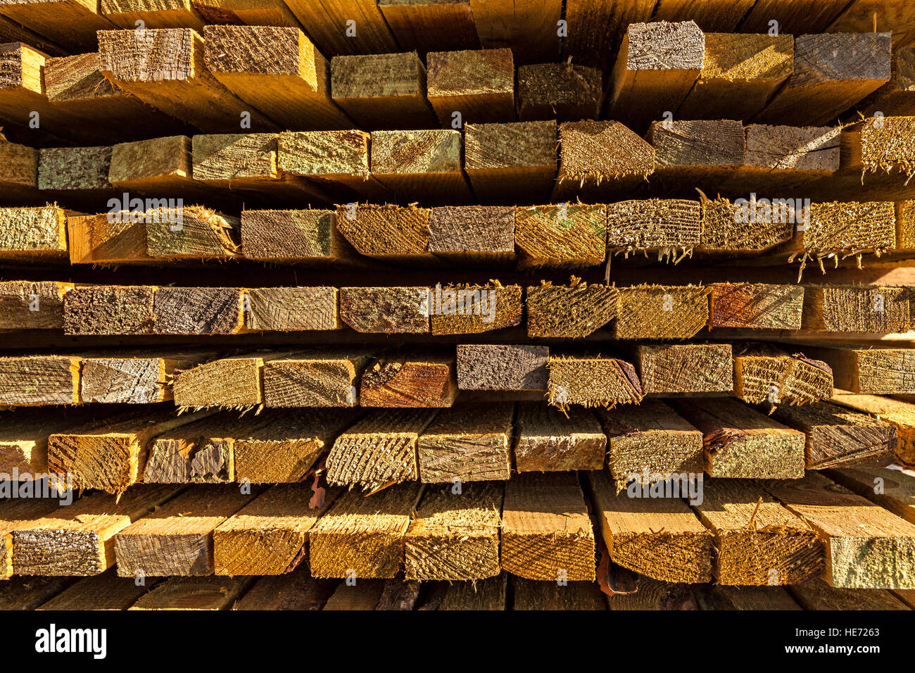 Stack of wooden boards in sawmill Stock Photo - Alamy