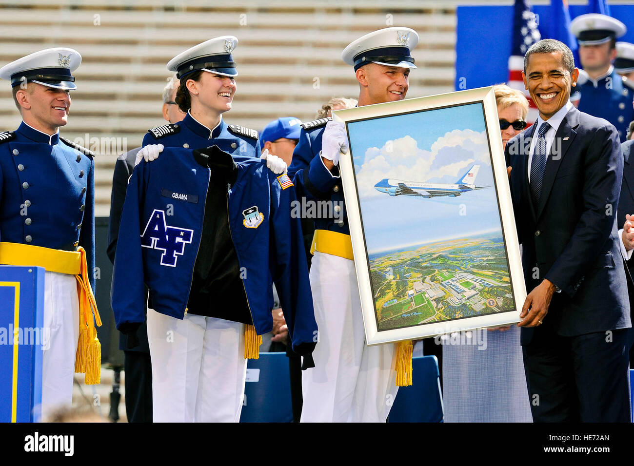 President Barack H. Obama receives a gift from senior ranking cadets ...