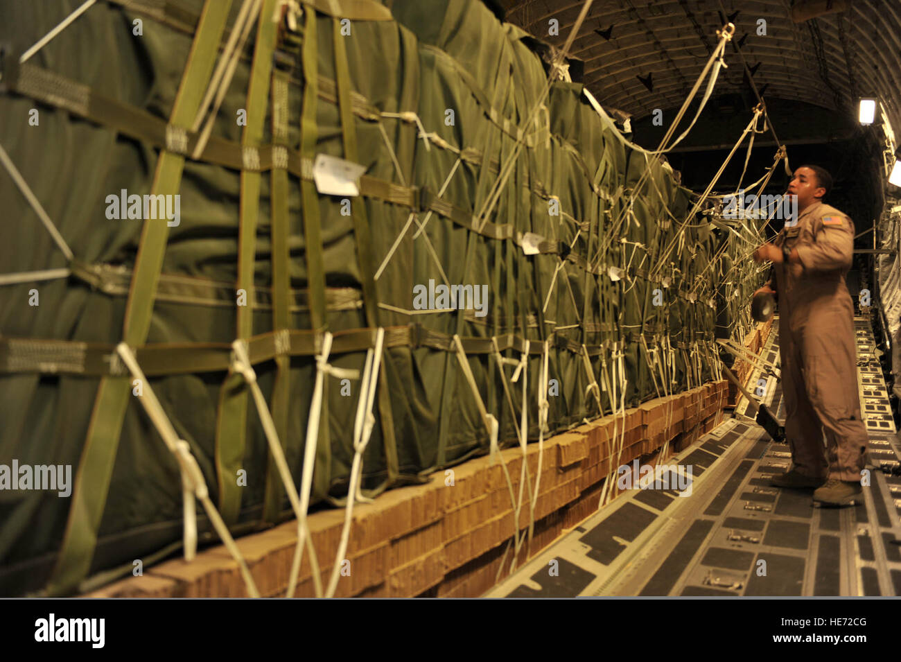 U.S. Air Force Senior Airman Kevin Johnson, a loadmaster assigned to ...