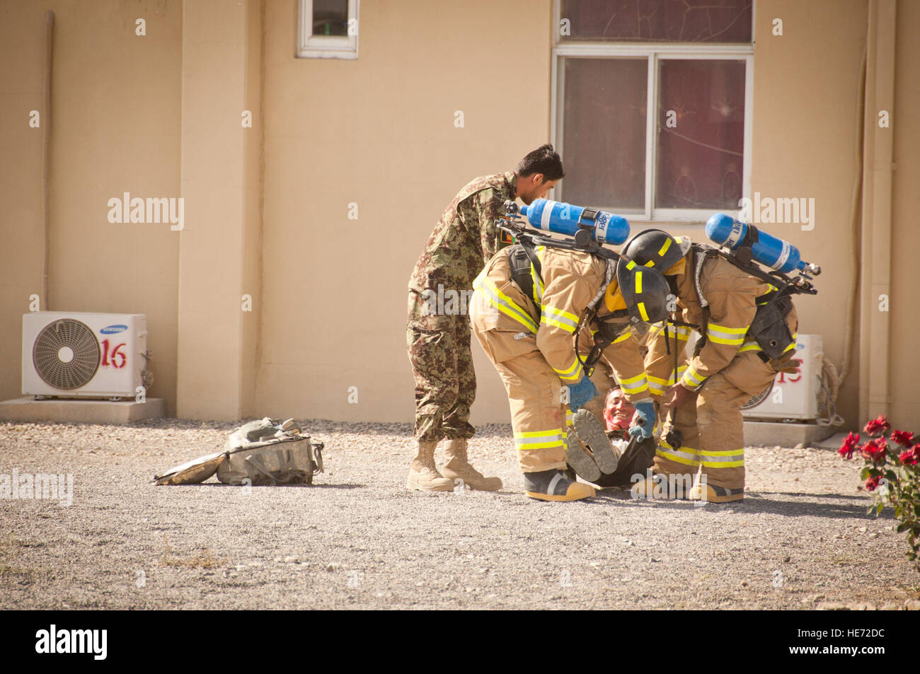Afghan Air Force firemen load a simulated patient into an ambulance at ...