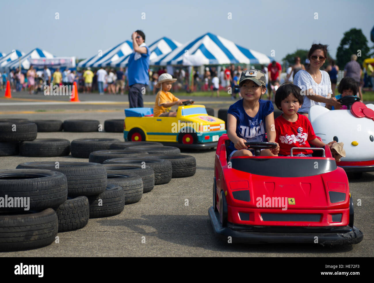 YOKOTA AIR BASE, Japan -- Children enjoy miniature go-carts at the ...