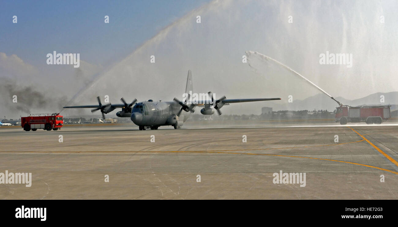 An Afghan air force C-130 taxis onto the ramp under celebratory streams ...
