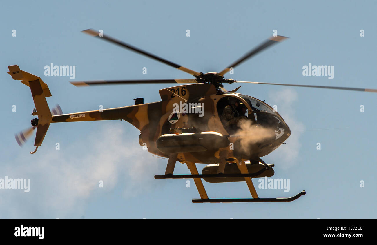 Afghan Air Force MD-530F Cayuse Warrior helicopter fires its two FN M3P ...
