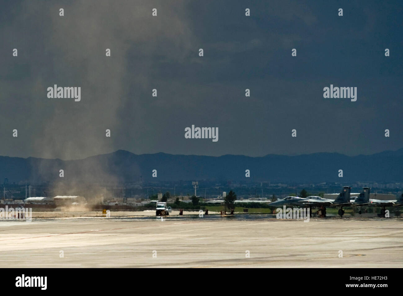 A dust devil whirls through the flight line just before the afternoon ...