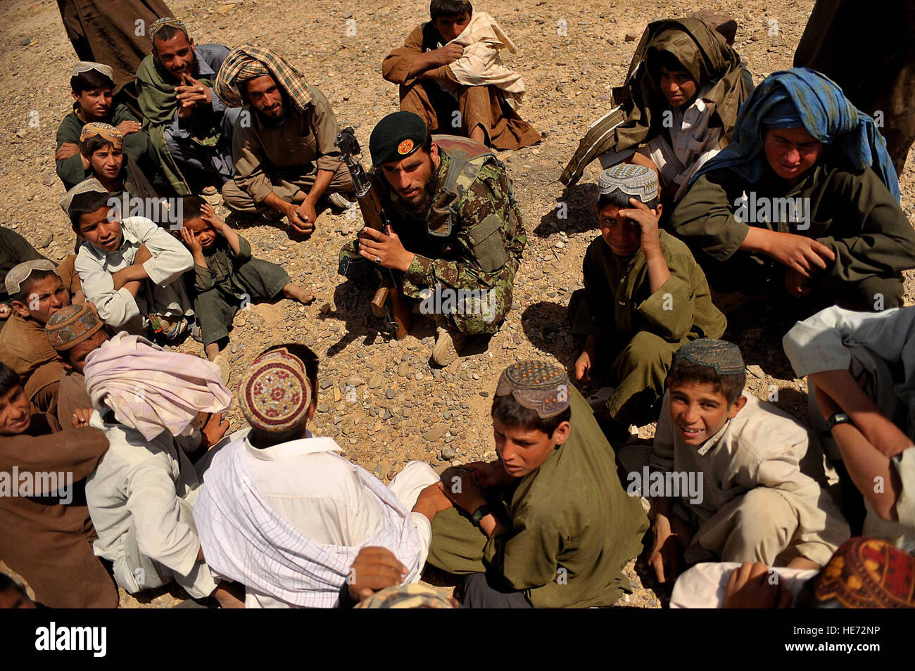 An Afghan National Army Soldier sporting the new ANA uniform talks with ...