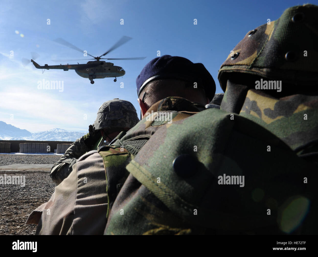 Afghan National Army (ANA) soldiers and coalition forces await to board ...