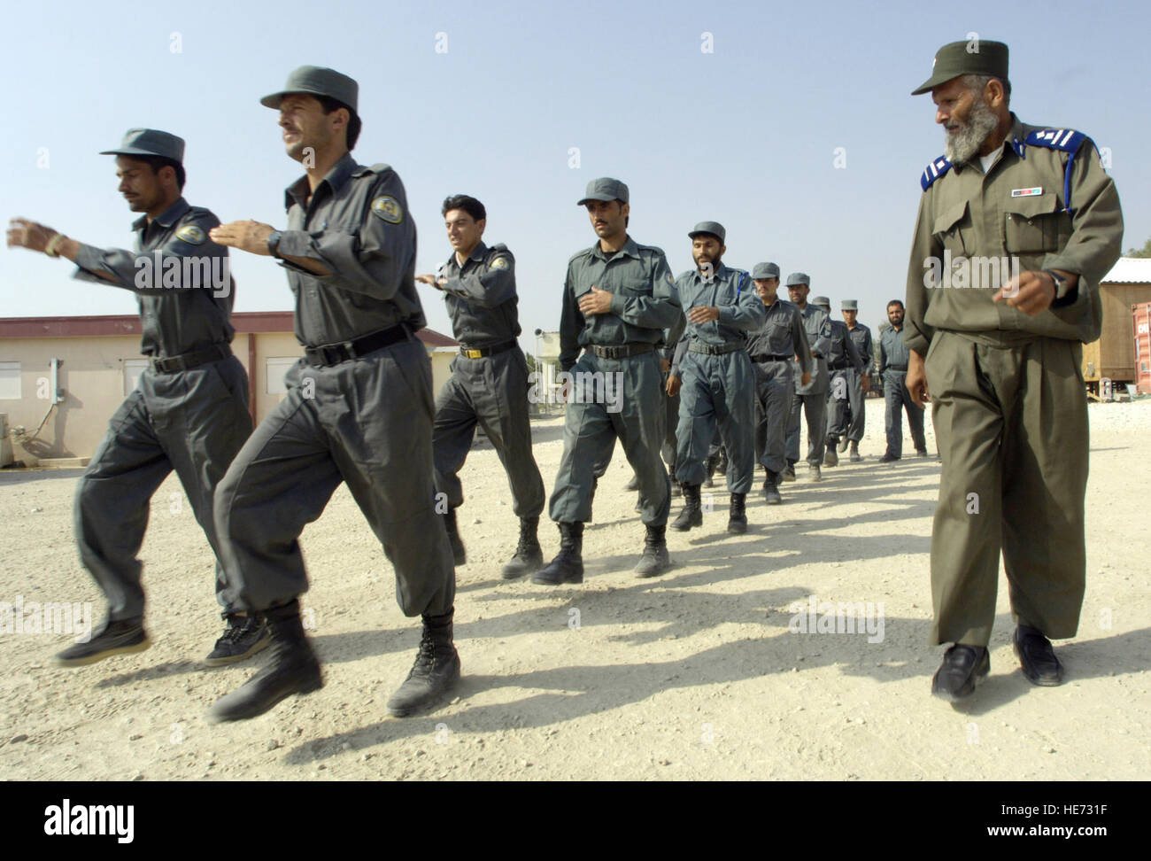 Afghan national police (ANP) Capt. Muhammad Ishaq, right, calls out ...