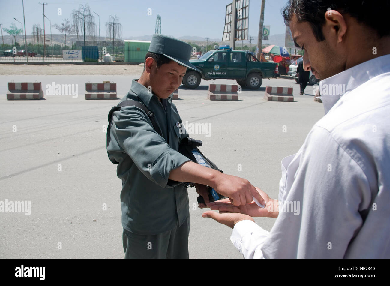 100605-F-1020B-004 Afghan National Police officer Mohammad Riza uses a ...