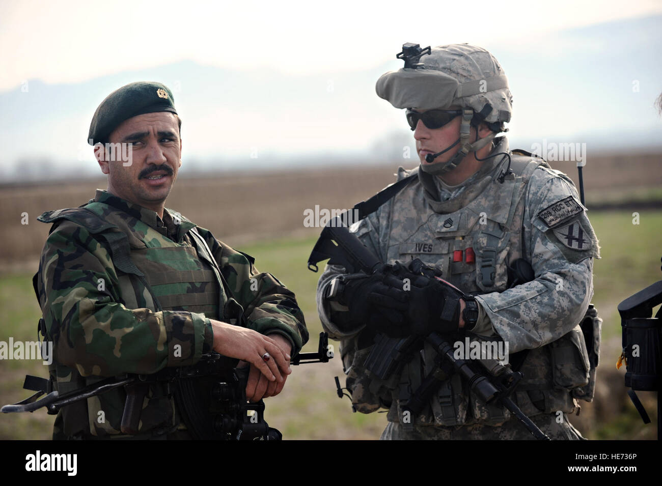 Staff Sgt. Nicholas Ives and Capt. Mohammad Ali Yazdani discuss the ...