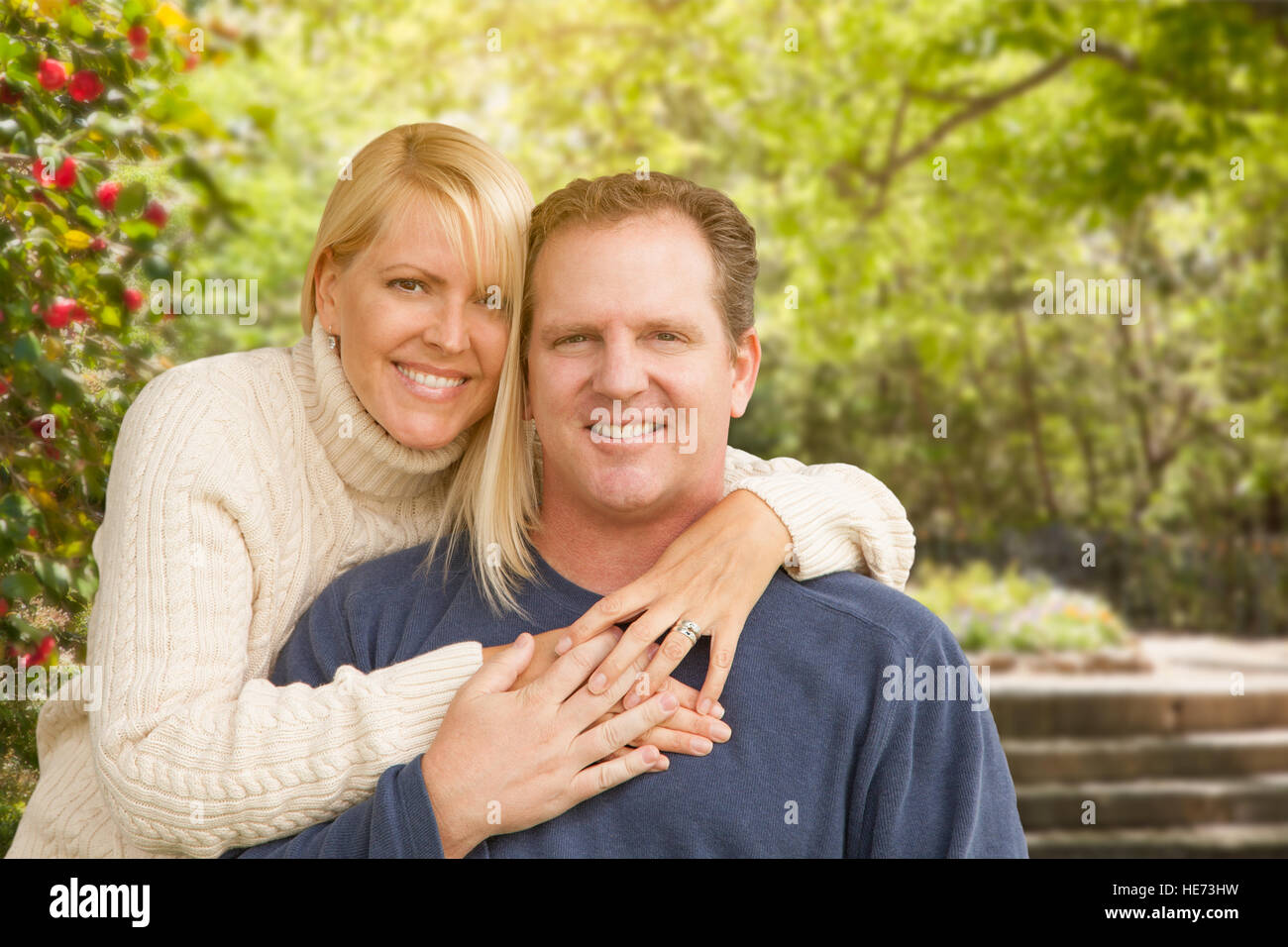 Happy Attractive Caucasian Couple Portrait in the Park Stock Photo - Alamy