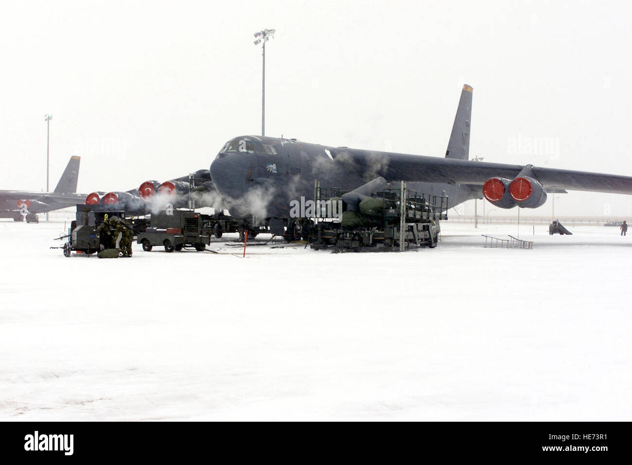 US Air Force (USAF) personnel assigned to the 23rd Bomb Wing (BW) load ...