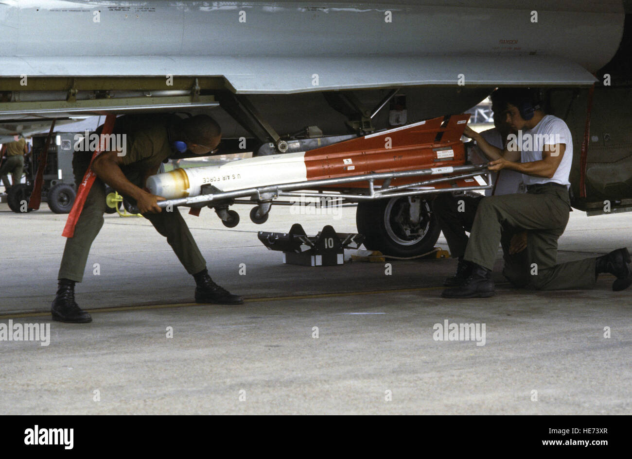 Personnel from the 49th Fighter Interceptor Squadron load an AIM-4 ...