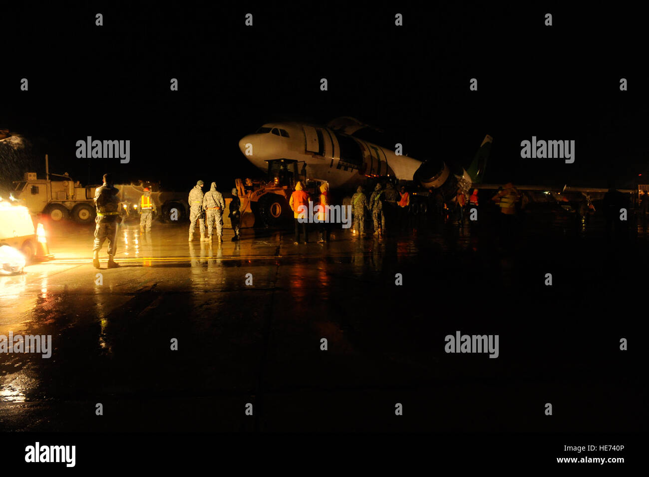 U.S. Air Force Airmen, Army Soldiers, and contractors move an Airbus ...