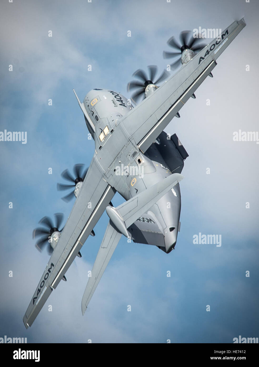 An A400M cargo aircraft performs for a crowd of industry professionals ...