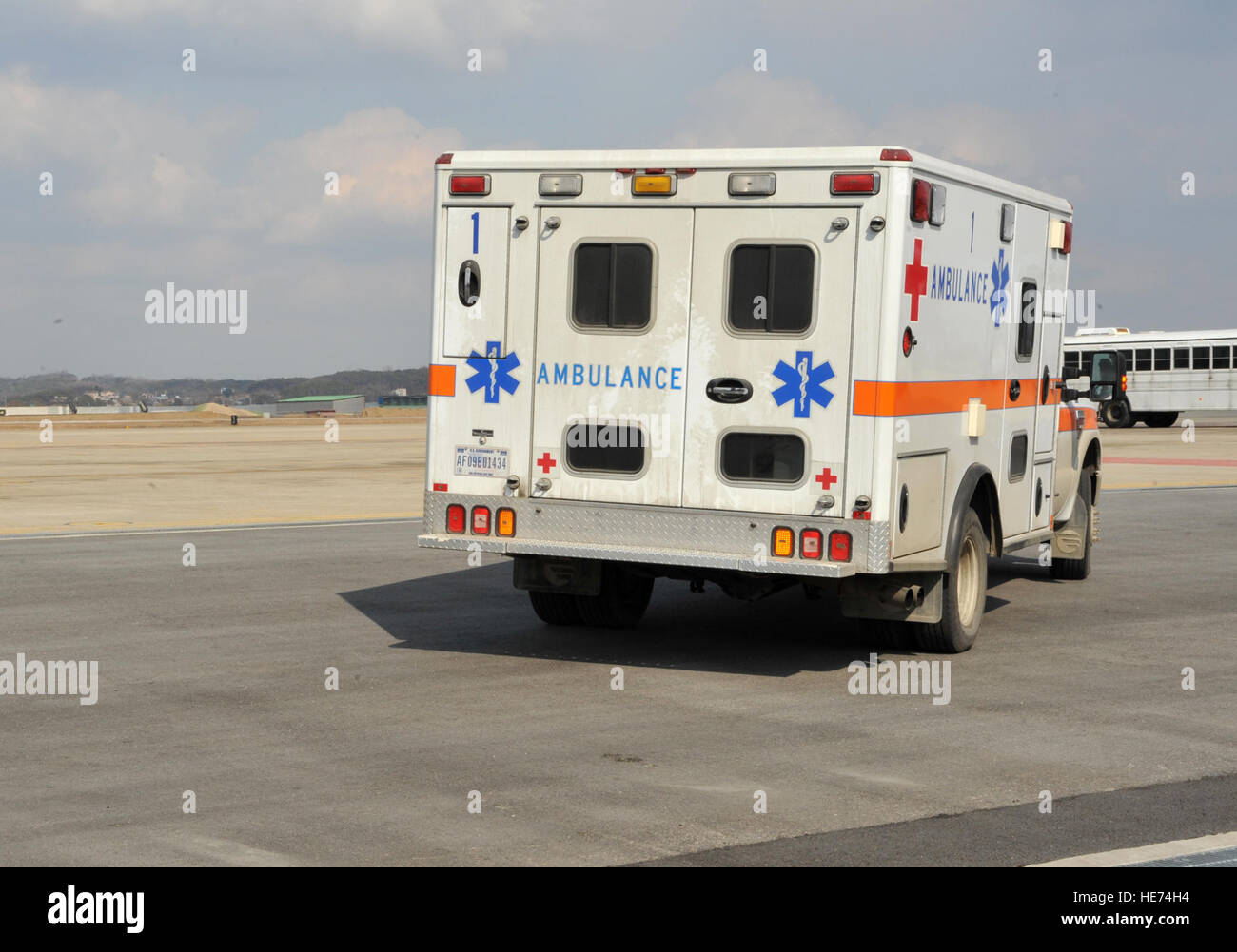 A 51st Medical Group ambulance leaves the flight line after picking up ...