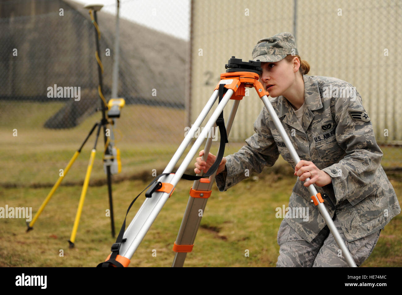 U.S. Air Force Senior Airman Olyia Bashaw levels a tripod while setting ...
