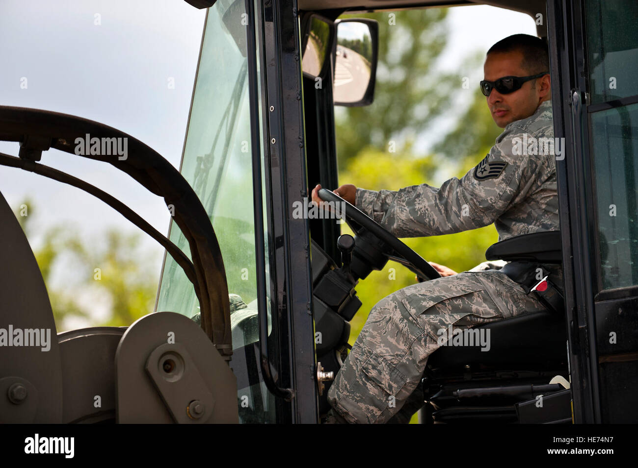 Staff Sgt. Russell Larsen operates a Caterpillar 10K All-Terrain ...