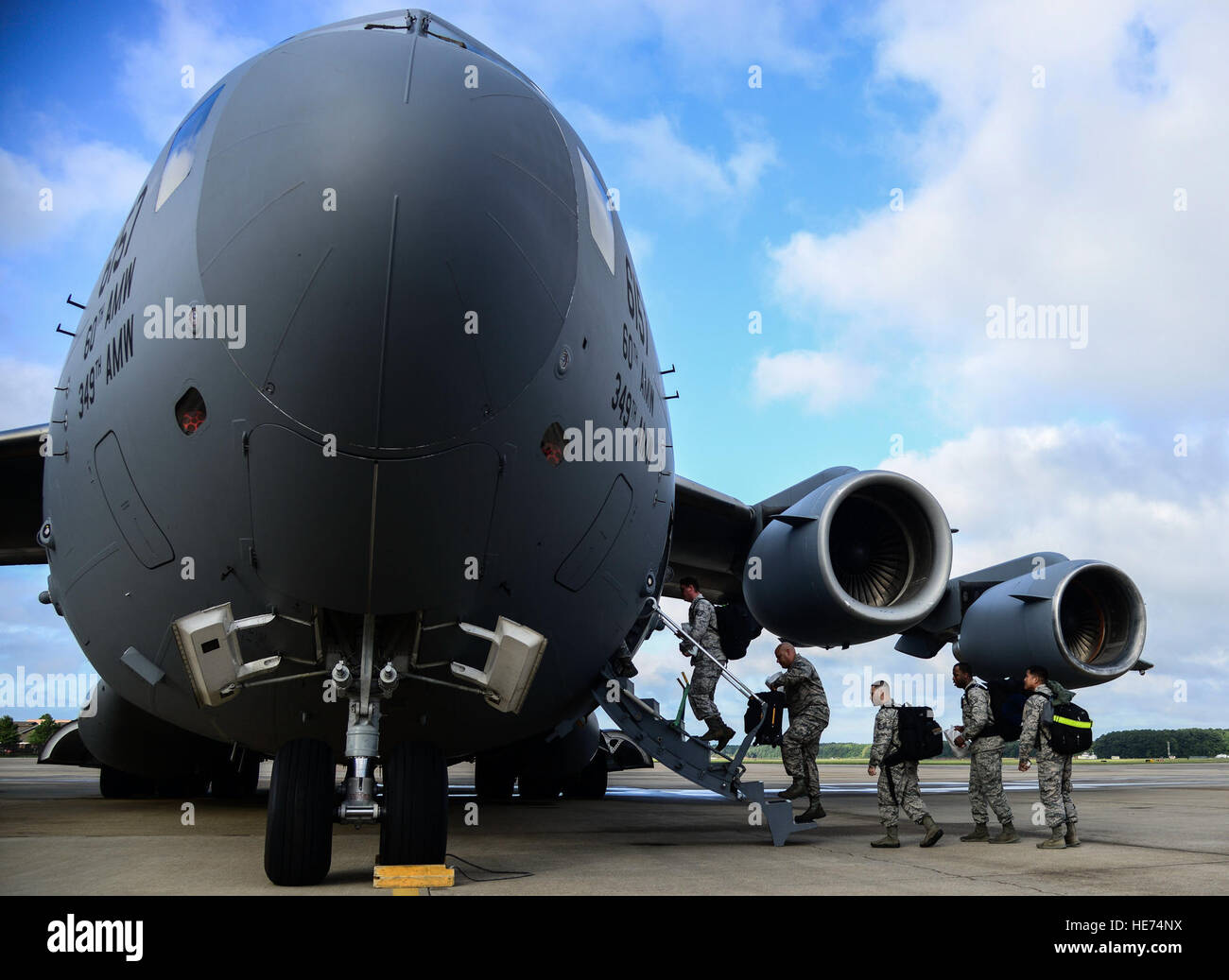 A C-17 Globemaster is loaded with cargo prior to departure at Langley ...