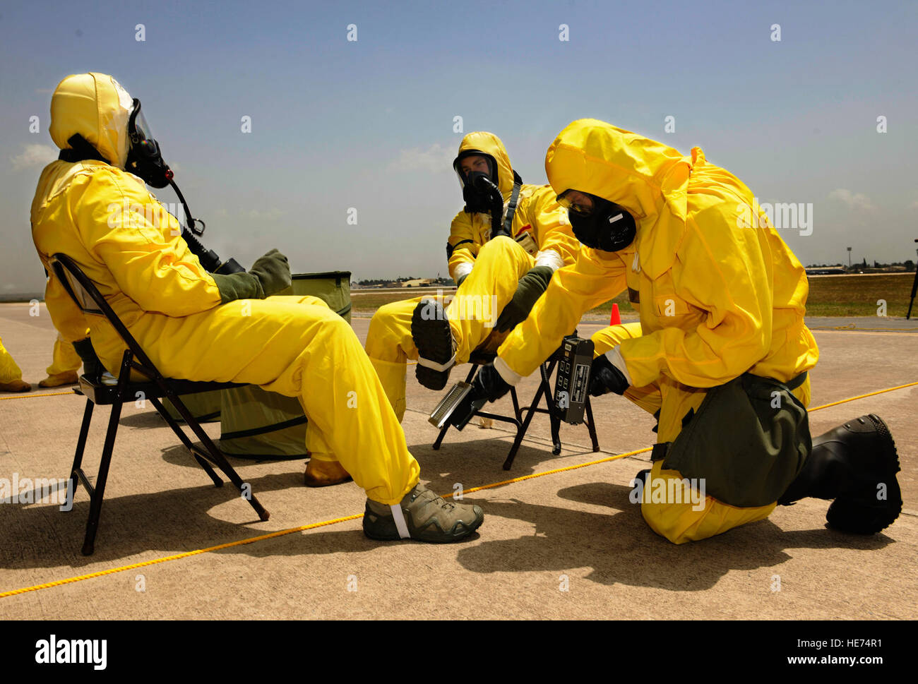 An Airman working as part of a contamination control station scans two ...
