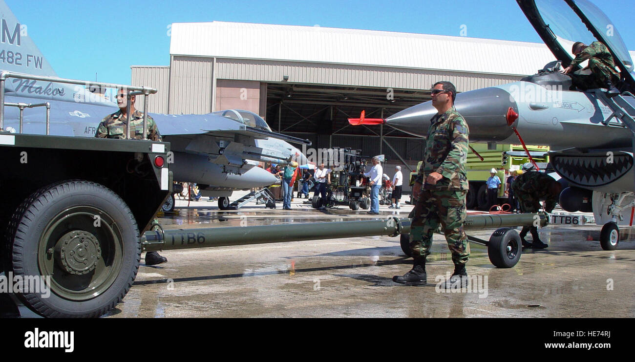 Airmen from the 482nd Fighter Wing move F-16 Fighting Falcons into ...