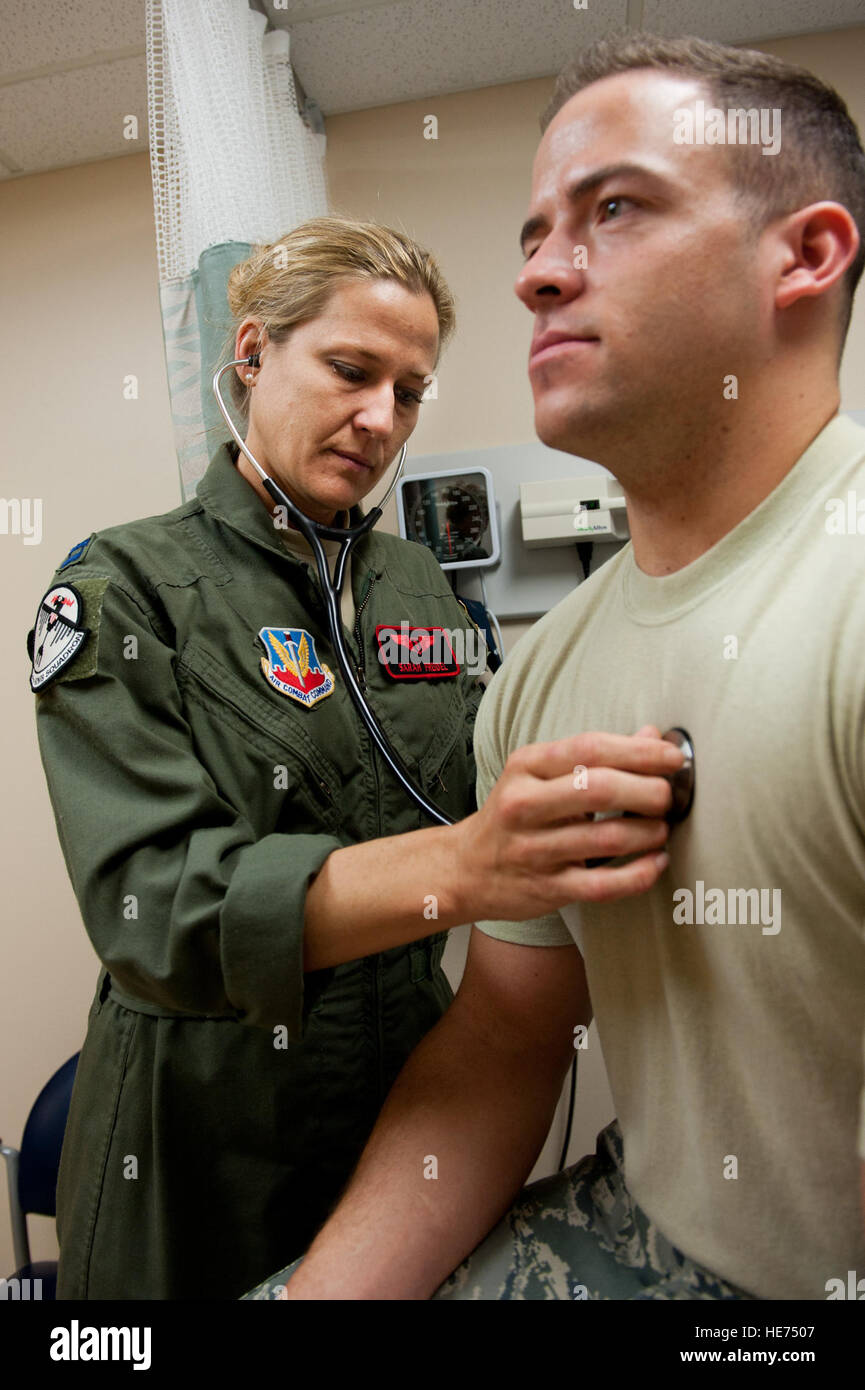 Capt. Sarah Freidel, 34th Bomb Squadron flight surgeon, listens to the ...