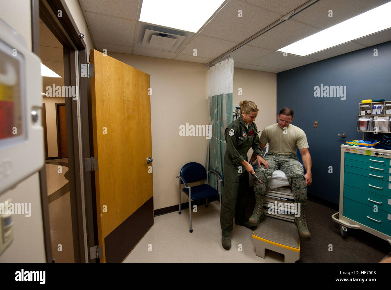 Capt. Sarah Freidel, 34th Bomb Squadron flight surgeon, checks the ...