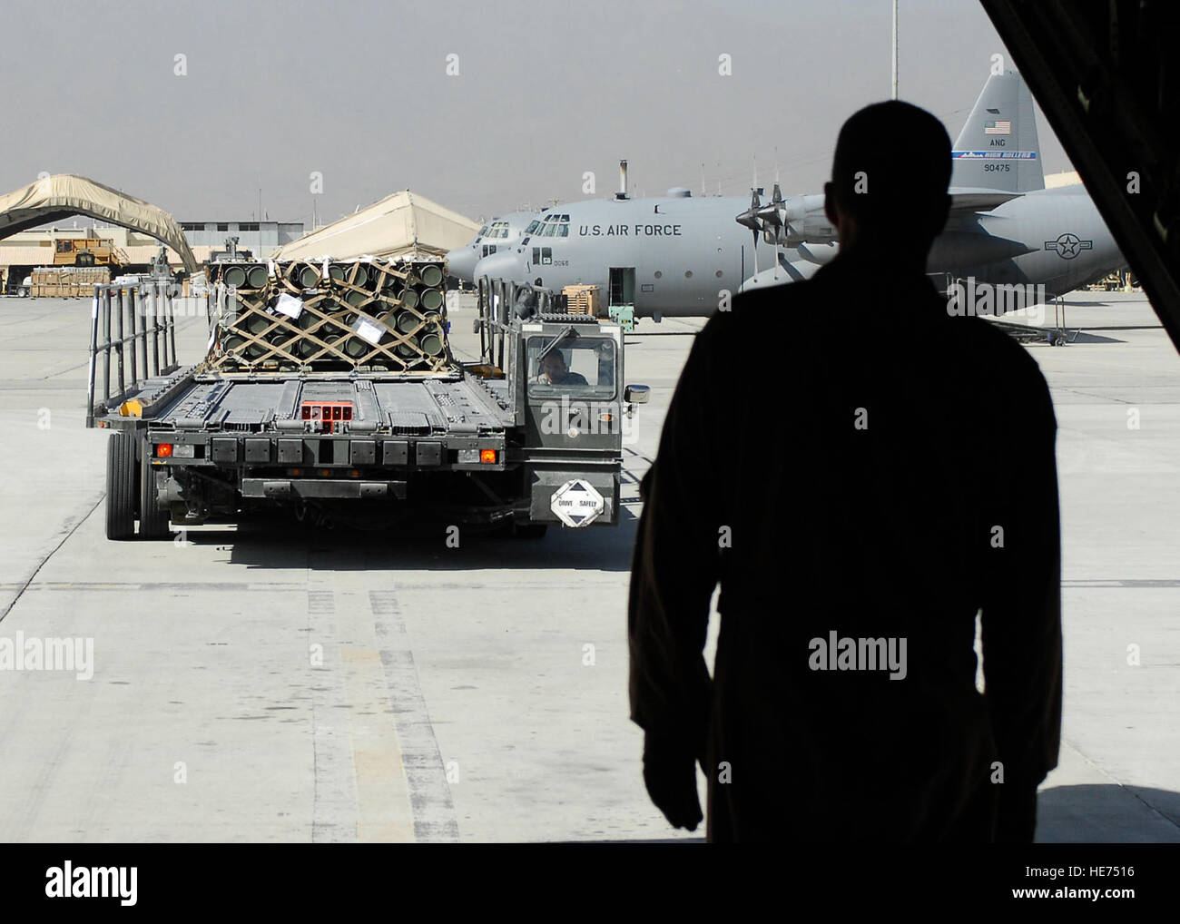 Staff Sgt. Terry Ellison (right), a loadmaster from the 774th ...