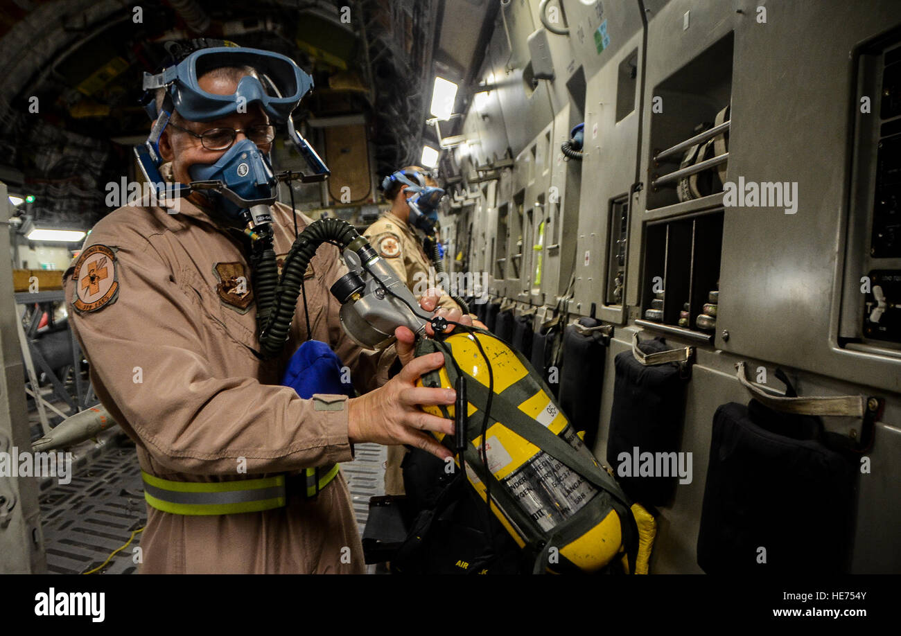 Tech. Sgt. Robert McNeal tests a portable oxygen tank before an ...