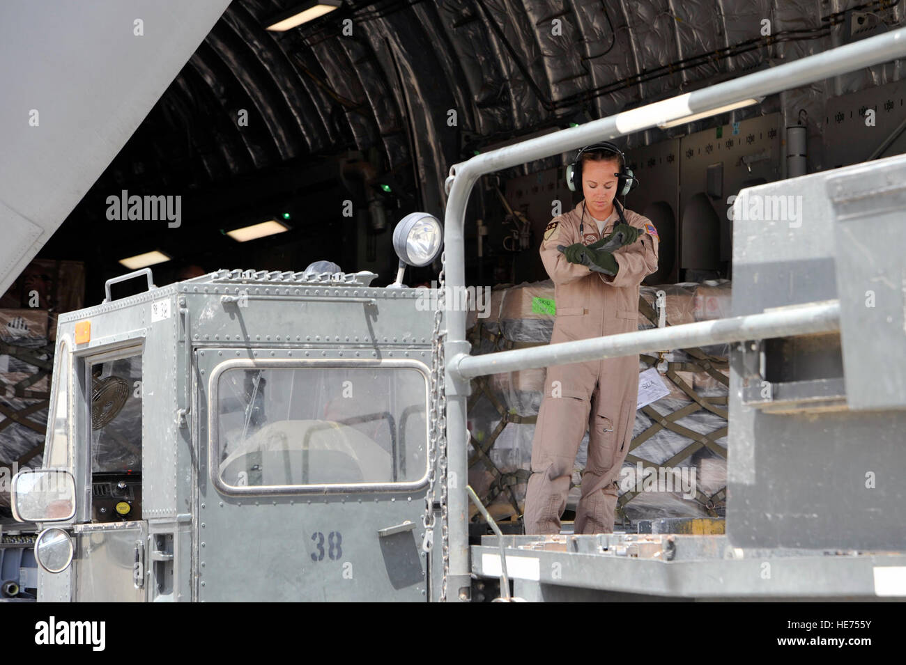 Tech. Sgt. Lindy Snodgrass, C-17 Globemaster III loadmaster, marshals a ...