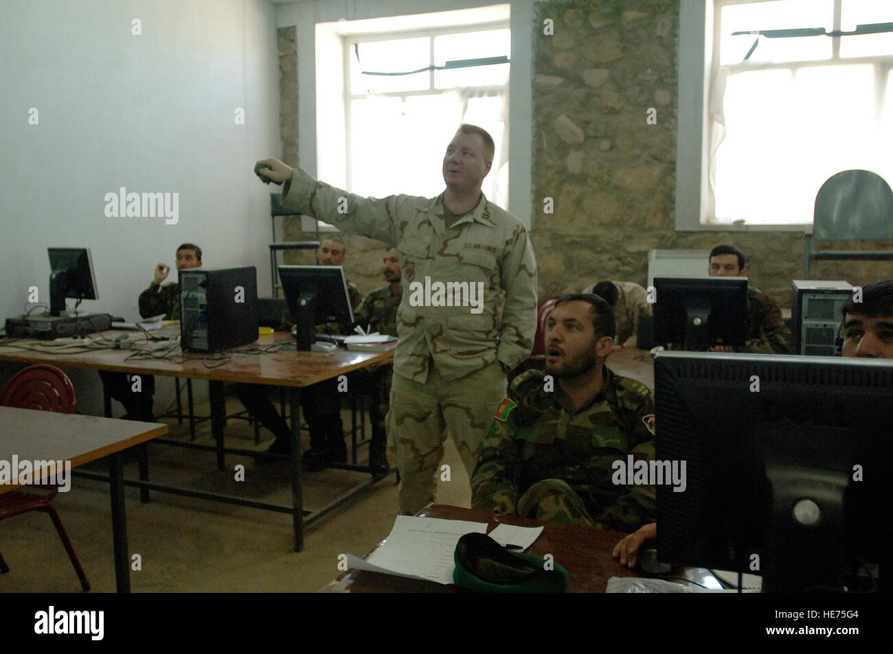 Kabul, Afghanistan -- Capt. Thaddeus Janicki teaches a computer ...