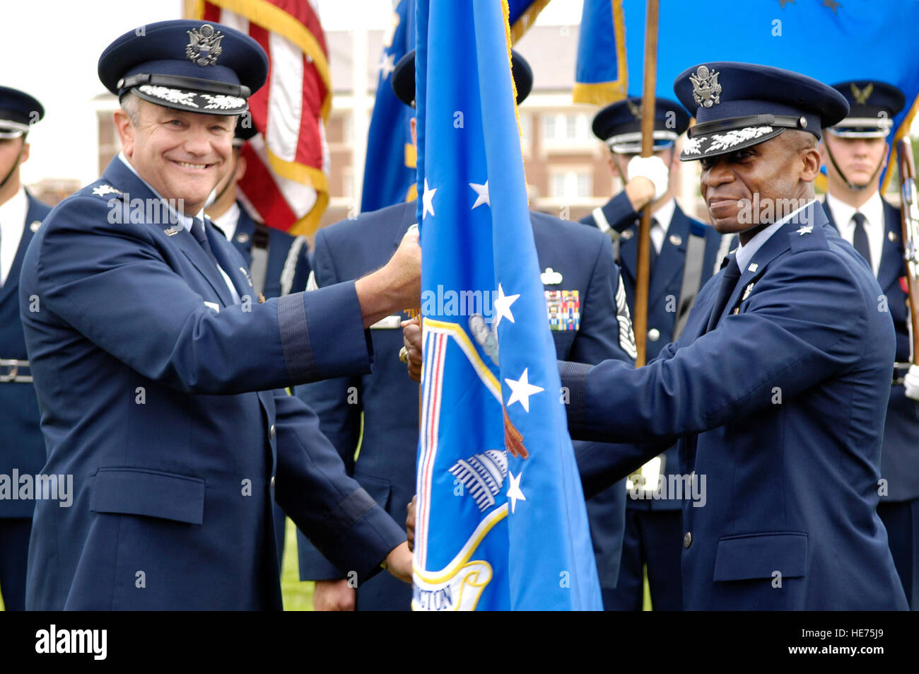 Maj. Gen. Darren W. McDew (right) relinquishes command of the Air Force ...
