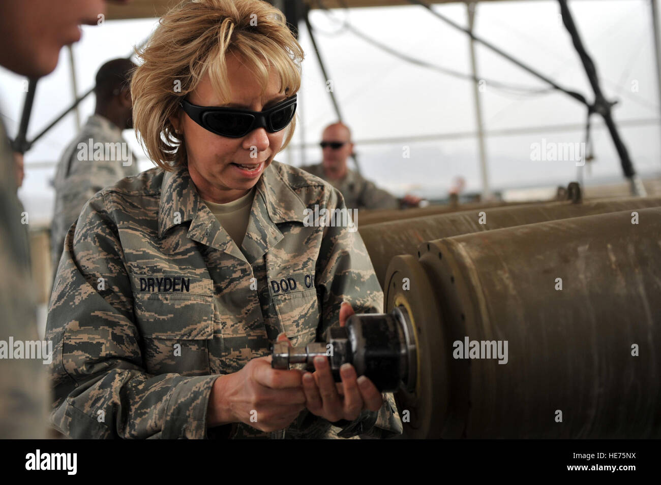 Ms. Sue Dryden, 309th Maintenance Wing director, installs tail fuse ...
