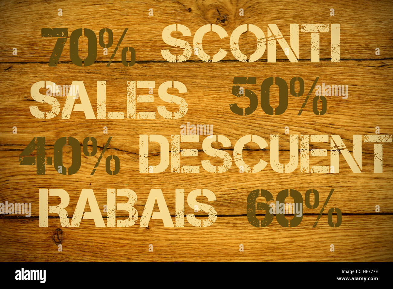 sales discounts in various languages on the wooden board Stock Photo ...