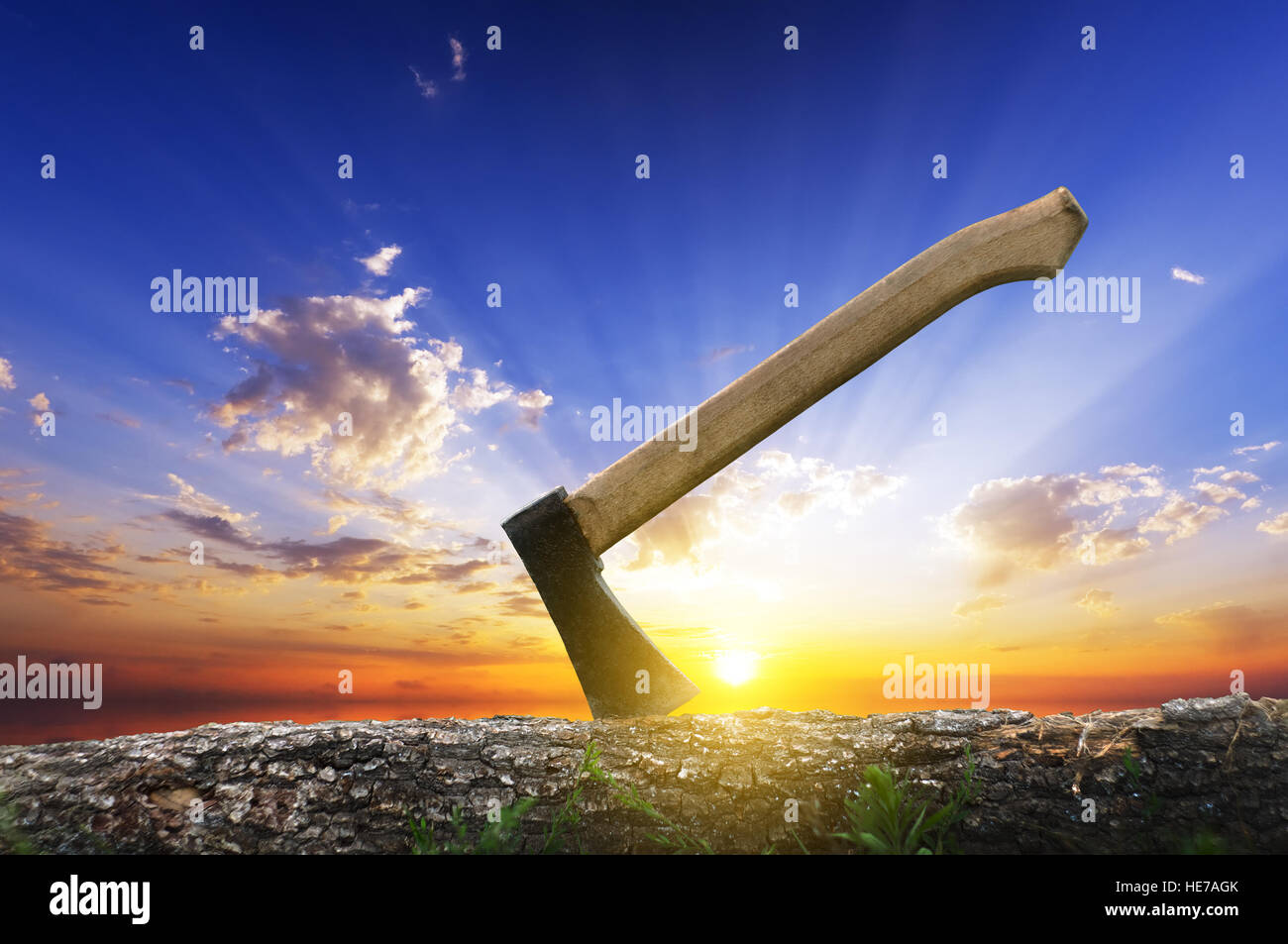 Axe in a log, closeup.scenic mountain landscape Stock Photo - Alamy
