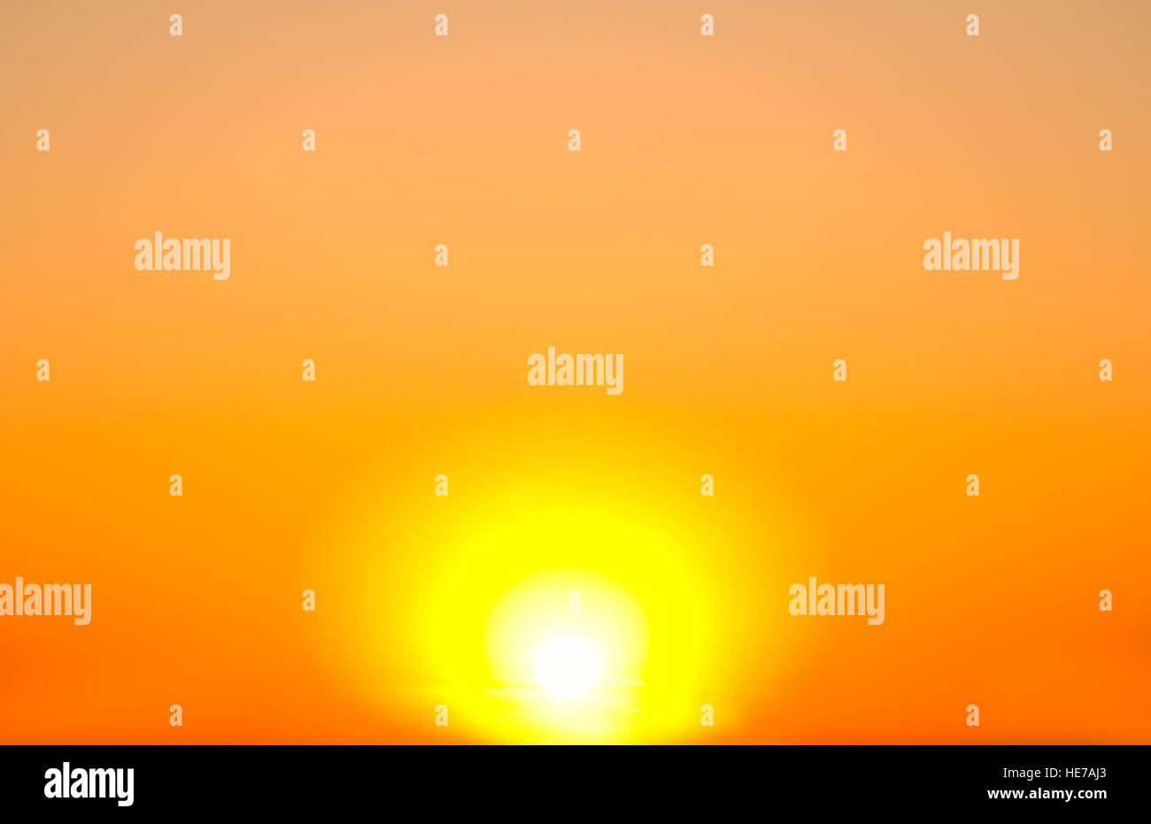 bright yellow rising sun against the clear orange sky.morning panorama ...