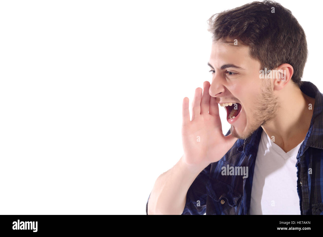 Portrait of a young man shouting. Isolated white background Stock Photo ...