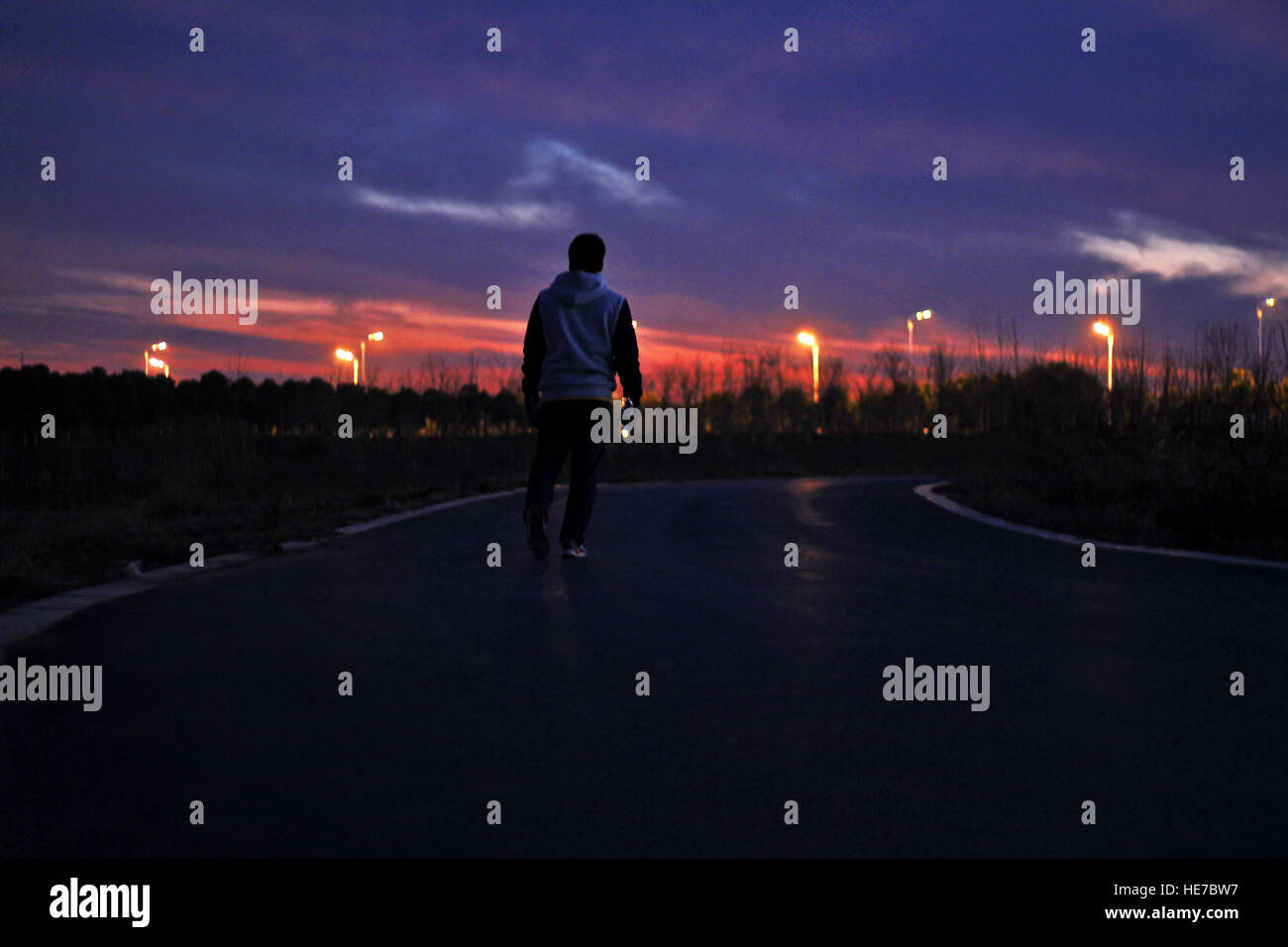 alone in sunset Stock Photo - Alamy