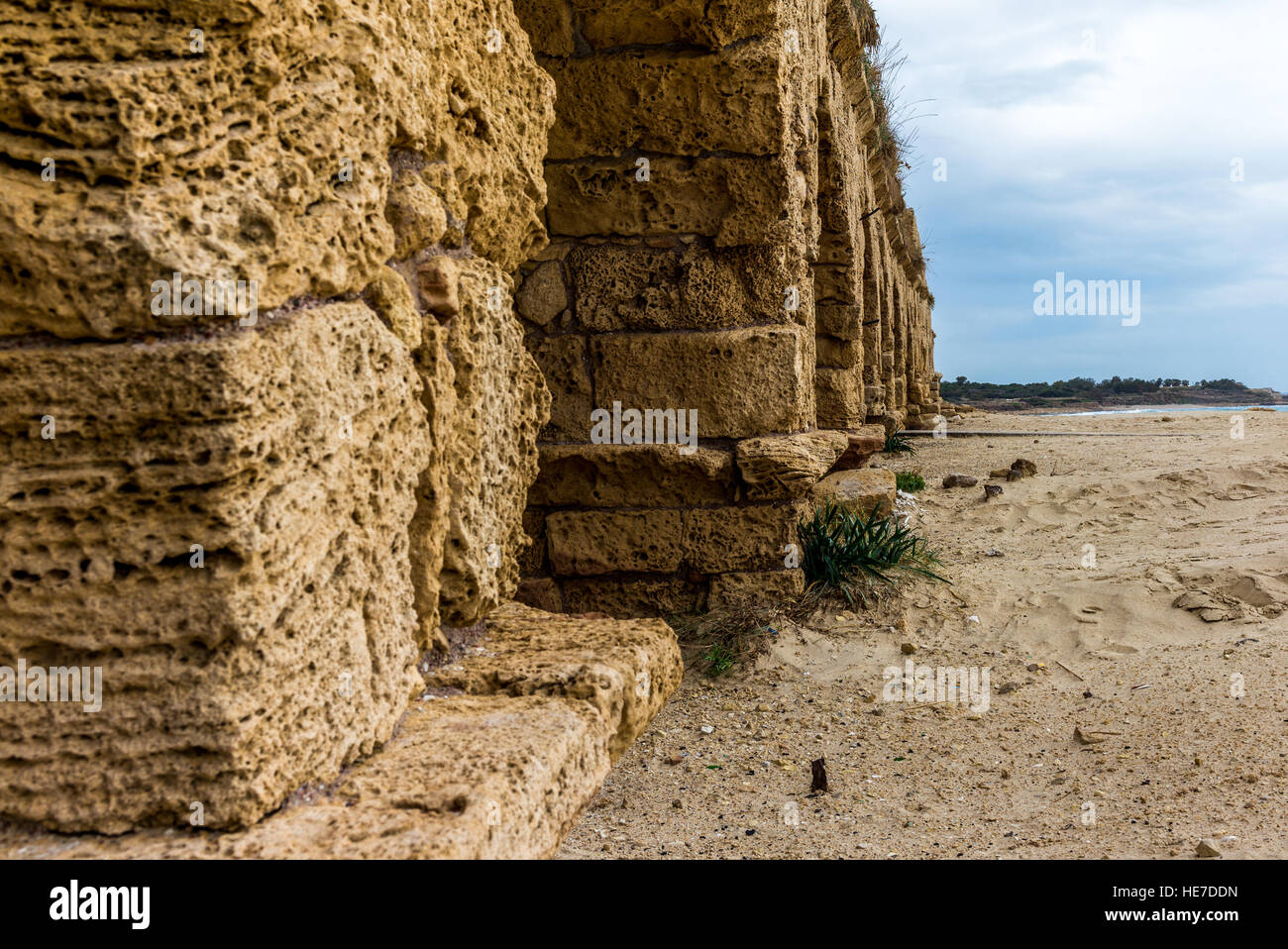 Spectacular view of the ruins of the Roman aqueduct on the beach of ...
