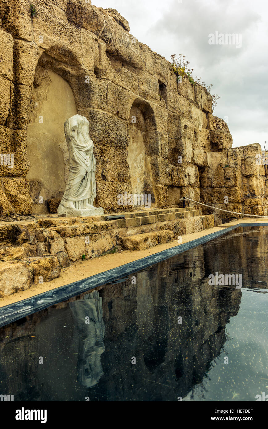 Roman emperor statue reflecting in a pool in Caesarea in Israel Stock ...