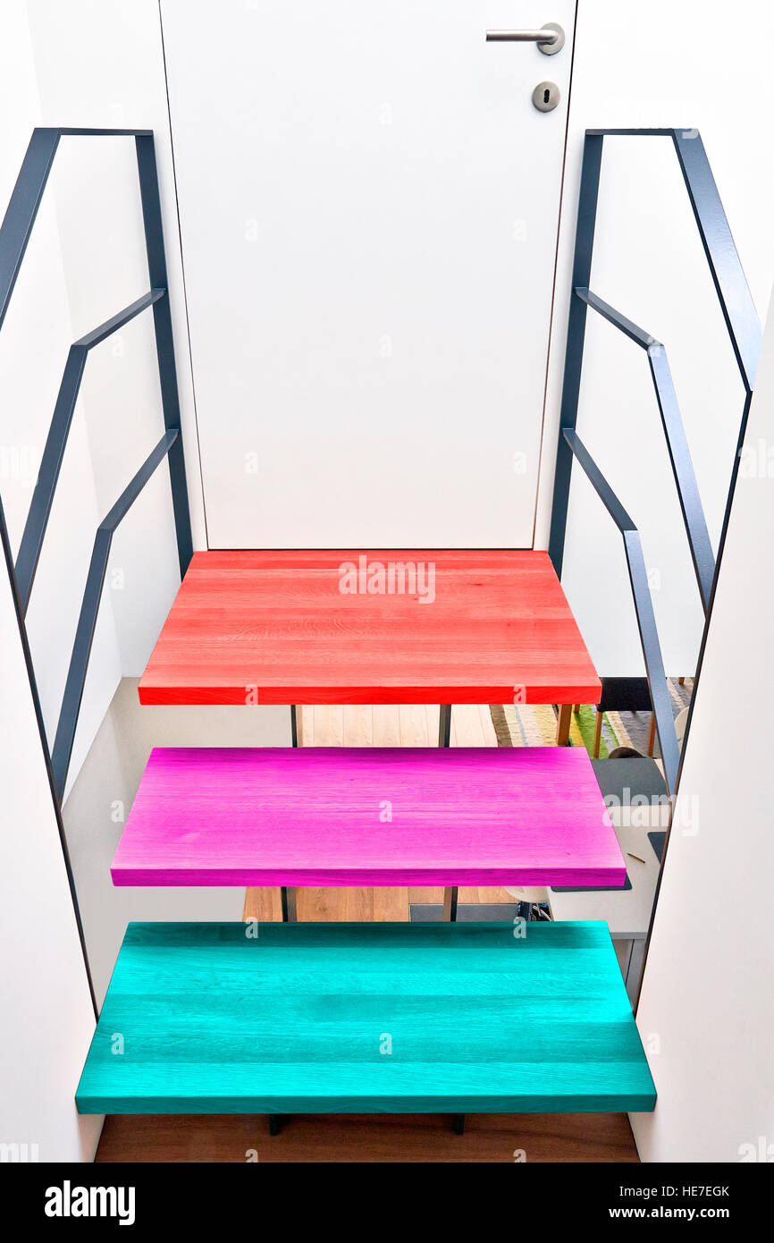 Multi colored Hardwood stairs and ramp in modern renovated living room ...