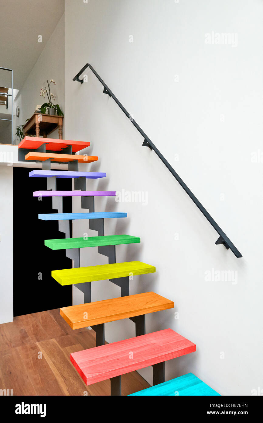 Multi colored Hardwood stairs and ramp in modern renovated living room ...