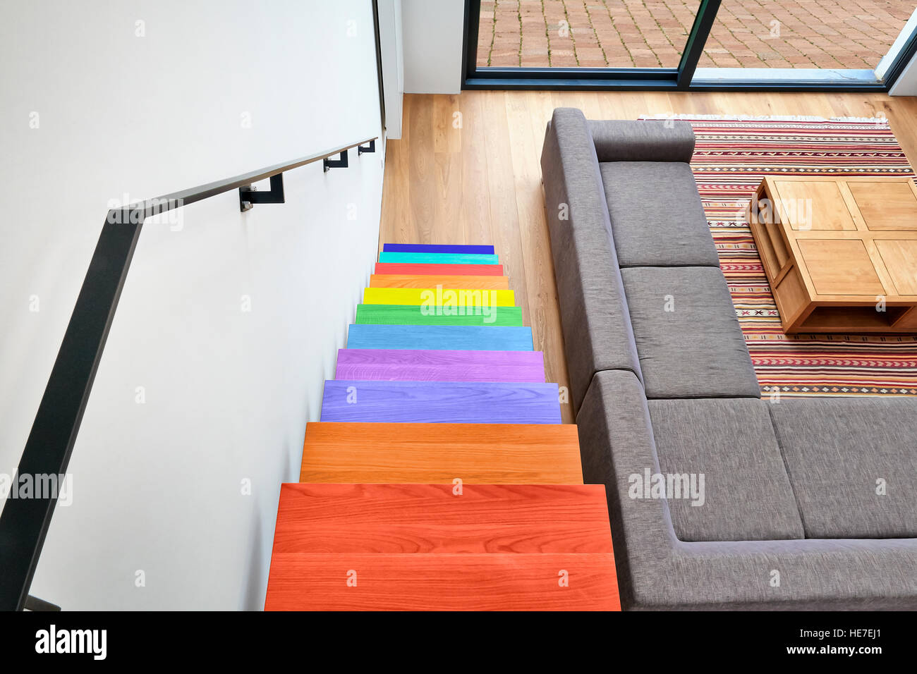Multi colored Hardwood stairs and ramp in modern renovated living room ...